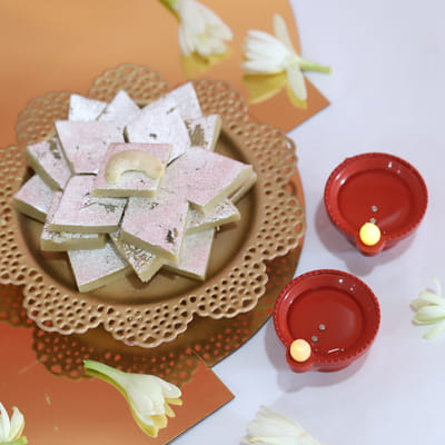 Buy/Send Kaju Katli 200 g & 2 Water Sensor Diyas Online | IGP | JVS1361265