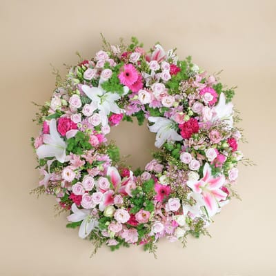 Buy/Send Small premium funeral wreath in shades of pink Online | IGP ...