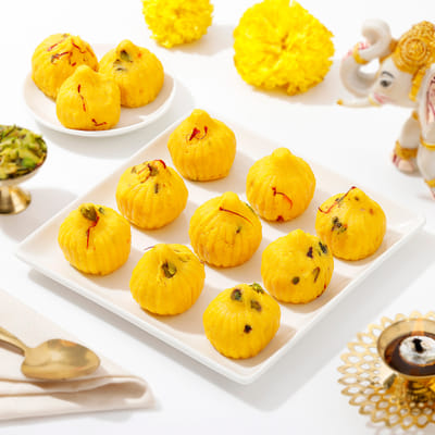 Buy/Send Tempting Kesar Pista Modak 12 pcs Online | IGP | JVS1302318